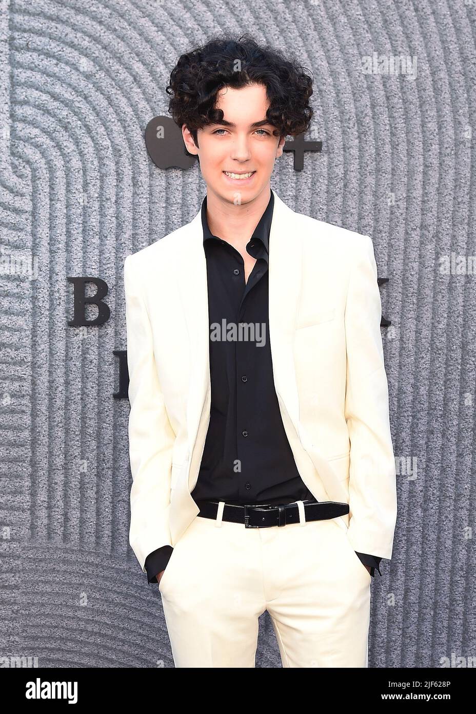 Braxton Alexander walking on the red carpet at Apple TV's "Black Bird" red carpet premiere event ...