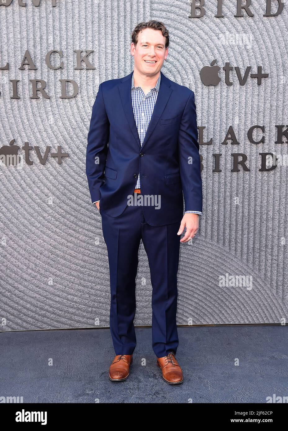 Joe Williamson walking on the red carpet at Apple TV's "Black Bird" red ...