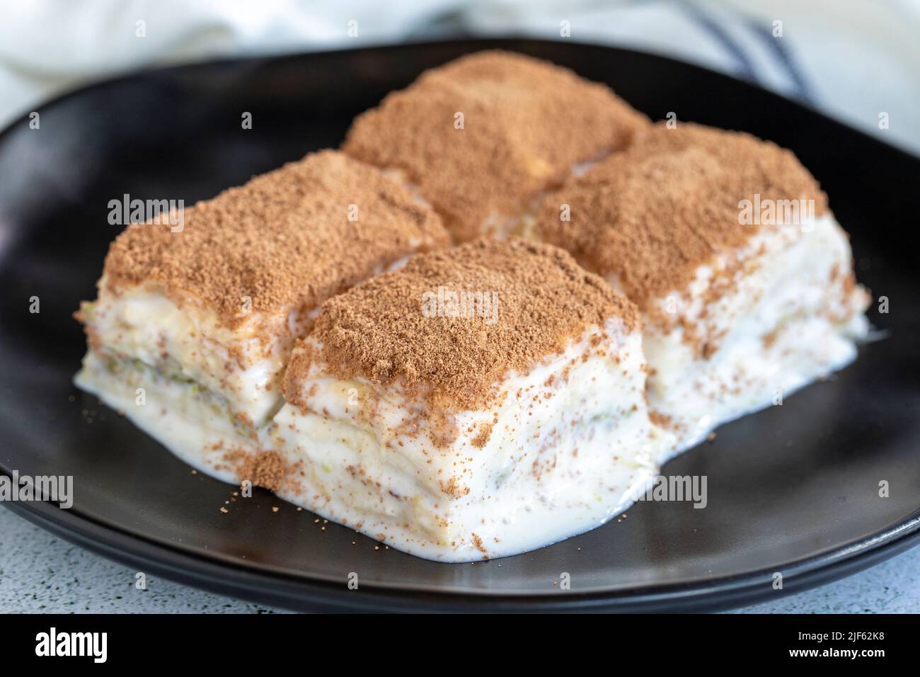 Cold baklava. Baklava with milk on a white background. Turkish cuisine ...