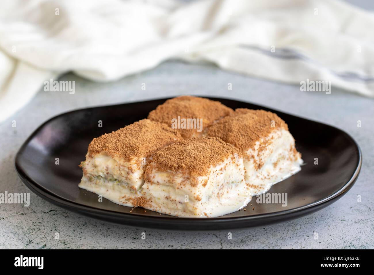 Cold baklava. Baklava with milk on a white background. Turkish cuisine ...