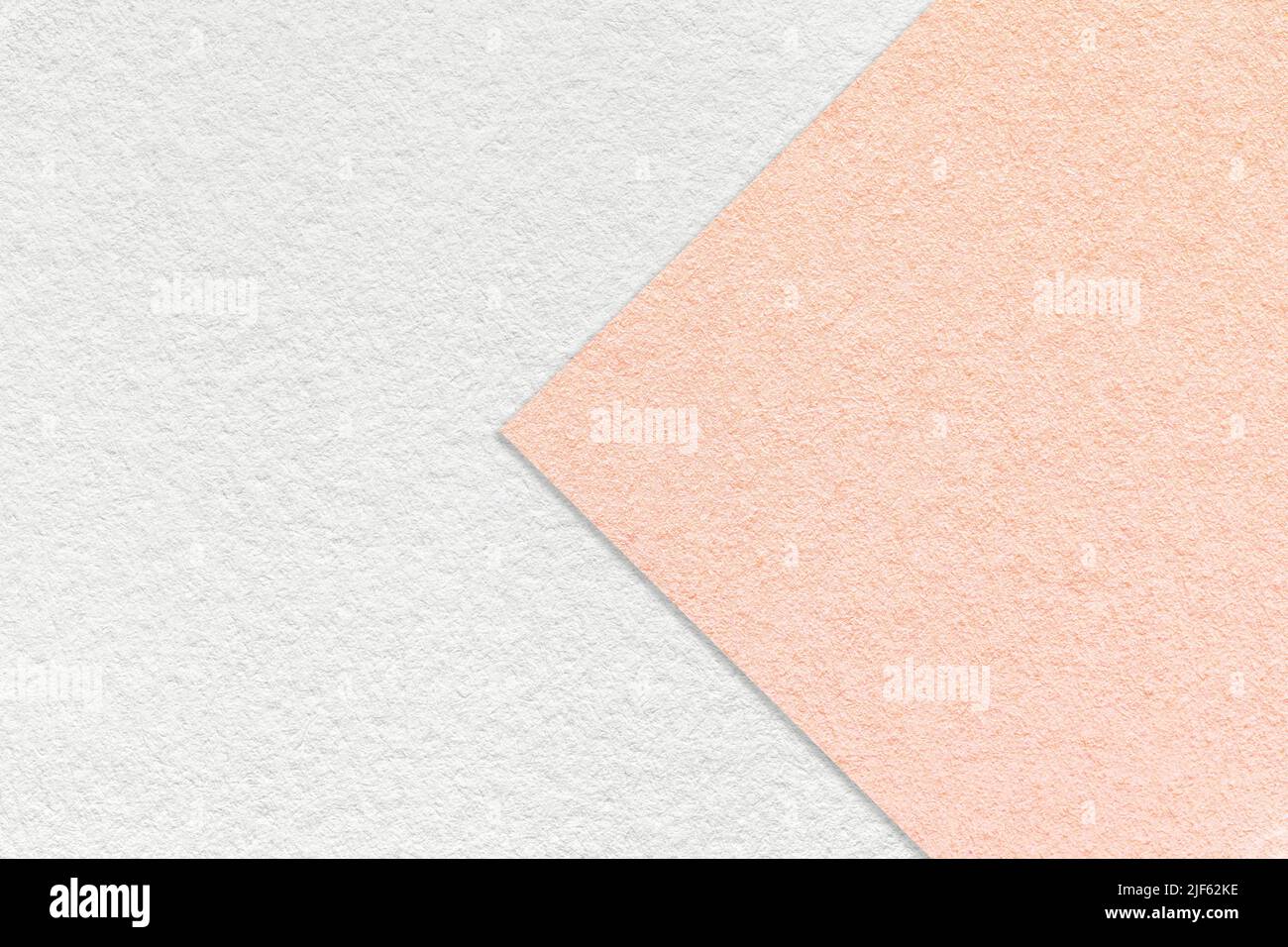 Texture of white and light pink paper background, half two colors with ...