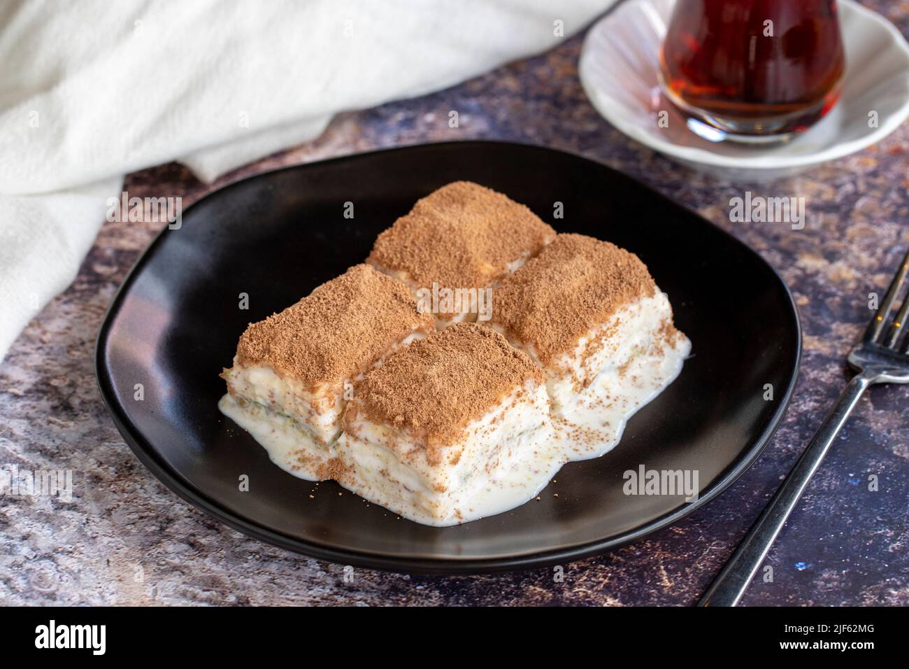 Cold baklava. Baklava with milk on a colored background. Turkish ...