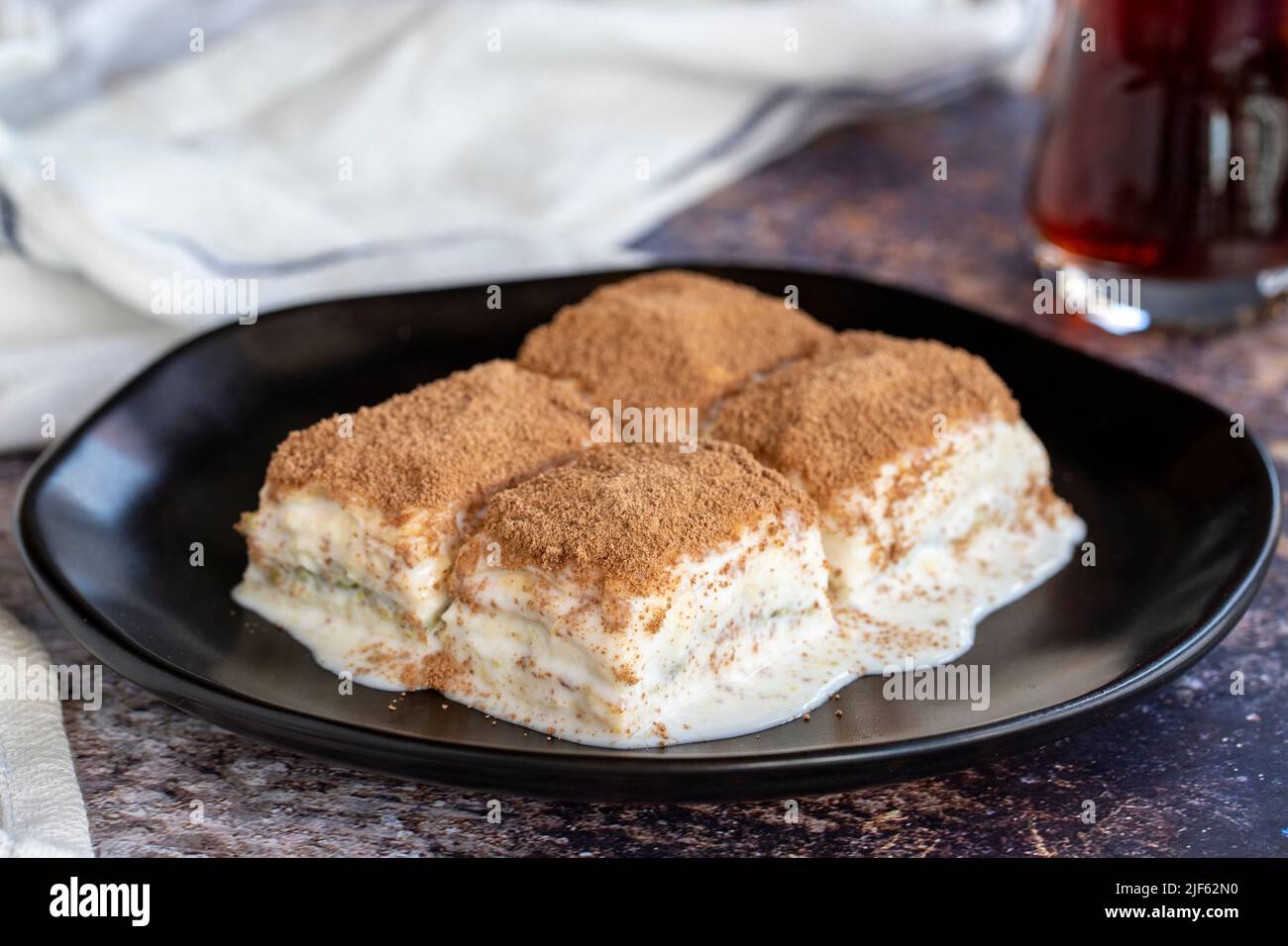 Cold baklava. Baklava with milk on a colored background. Turkish ...