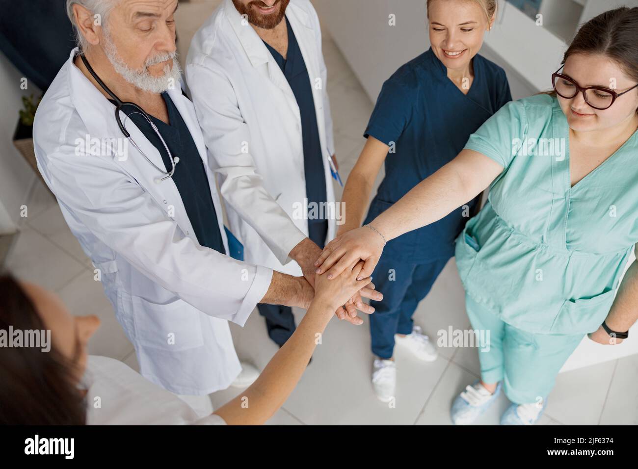 Group of professional medical team of doctors putting their hands ...