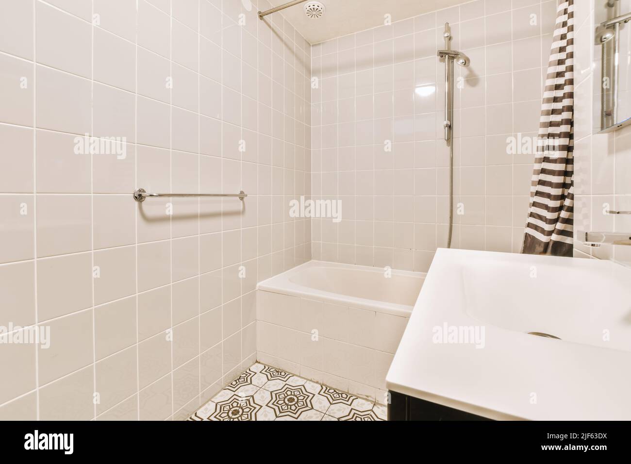 Sinks With Mirrors And Clean Bathtub Located Near Shower Box With Glass