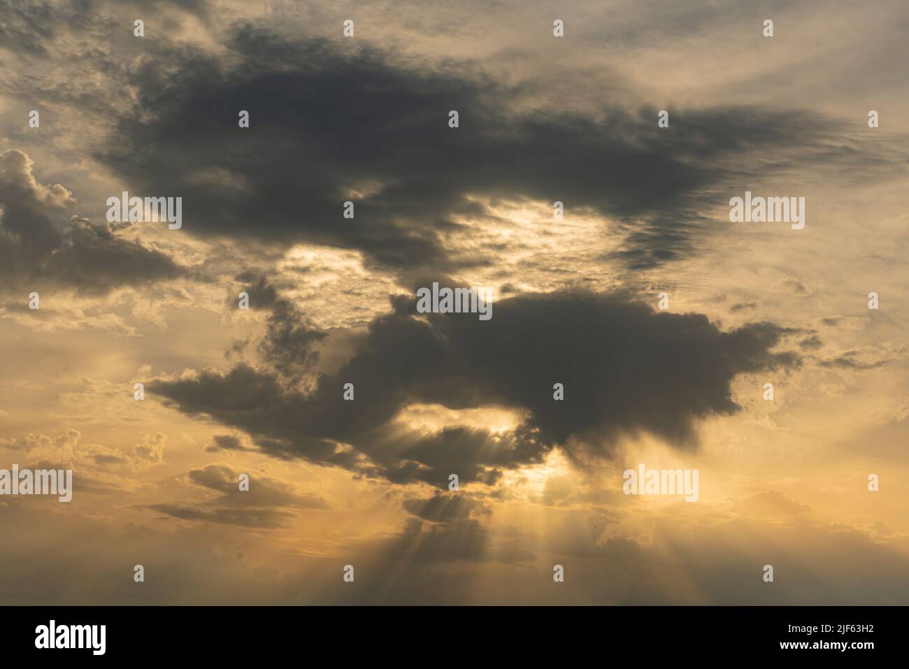 Clouds block the sun at sunset in the form of a human face Stock Photo ...