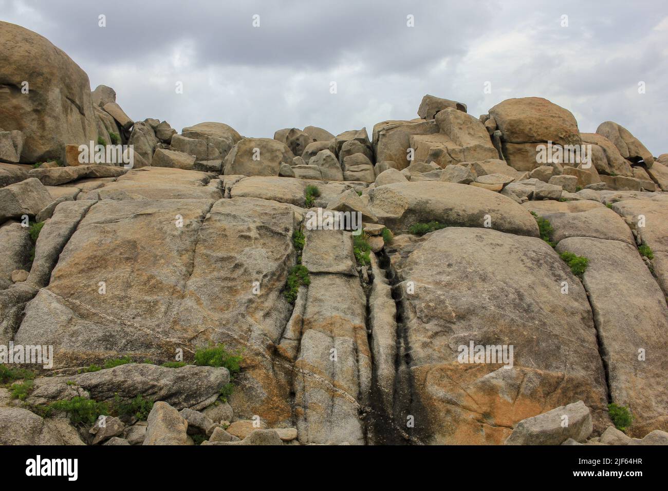 old, eroded rocks in the form of a high cliff by the sea Stock Photo ...