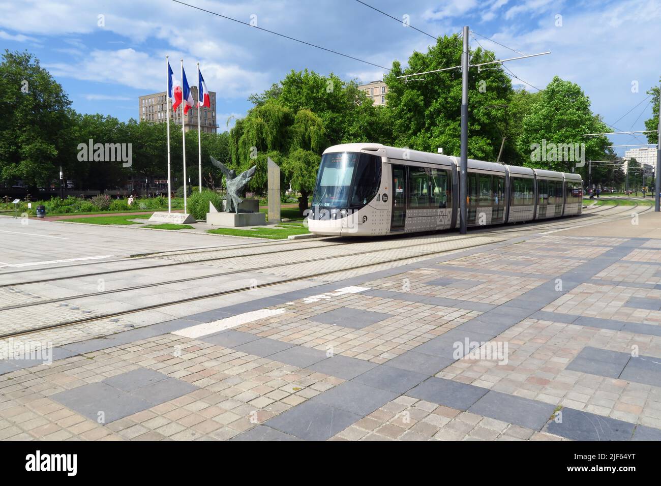 A city tram at a stop outside the Hotel de Ville, City Hall in the ...