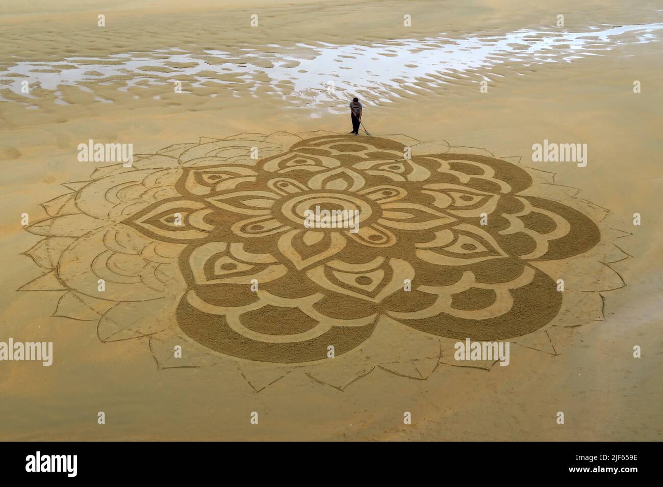 Raking sand hi-res stock photography and images - Alamy