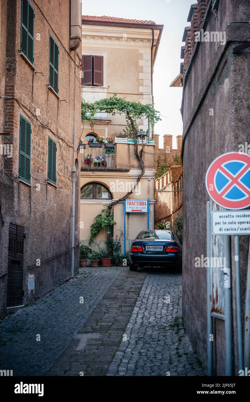 Cozy narrow street in the Nemi city in Italy Stock Photo - Alamy