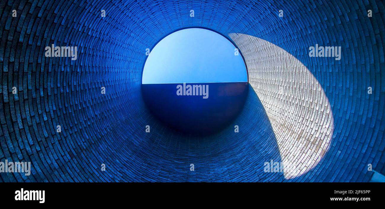 A low-angle shot from a building to a circle opening, great for ...