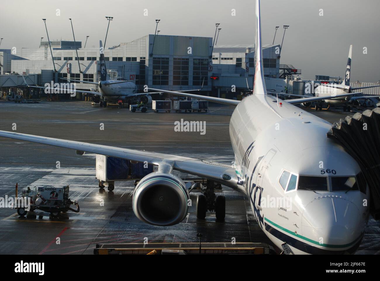 Jet sitting at an airport gate, ready to board Stock Photo - Alamy