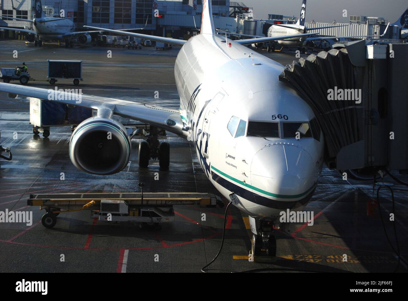 Jet sitting at an airport gate, ready to board Stock Photo - Alamy