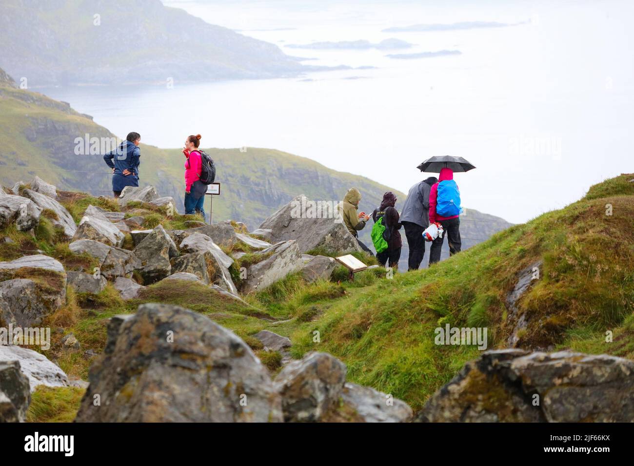 RUNDE, NORWAY - JULY 26, 2020: Bird watchers visit Runde island in the ...
