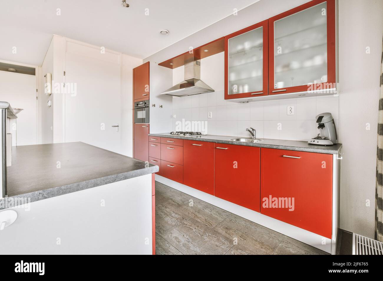 Counters with stove and oven located in modern kitchen near dining room ...