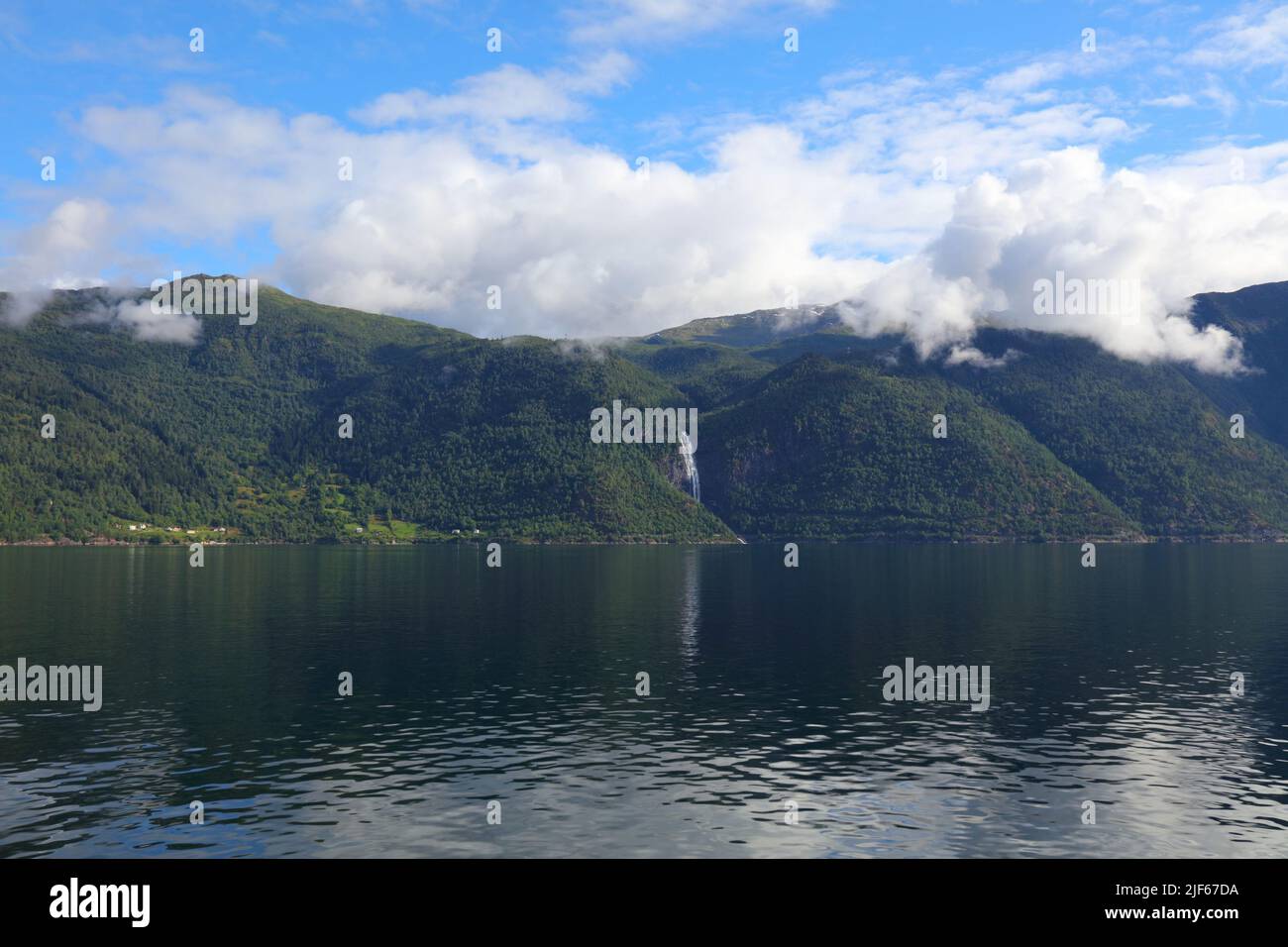 Norway fiord landscape. Sognefjord with low clouds and a waterfall ...