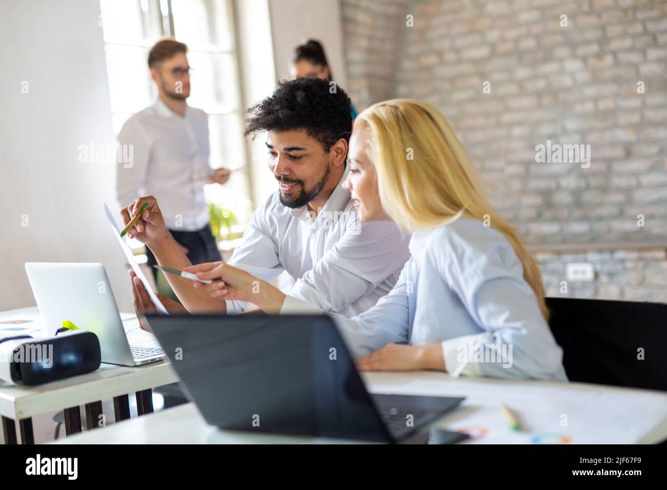 Group of success people working together at corporate workplace ...