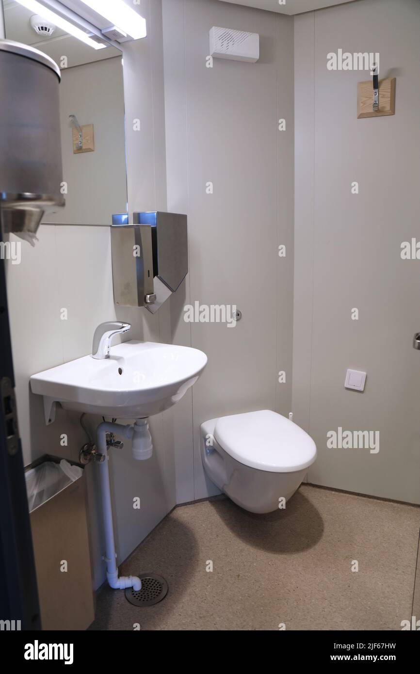 Public restroom sink and toilet onboard a ferry in Norway Stock Photo ...