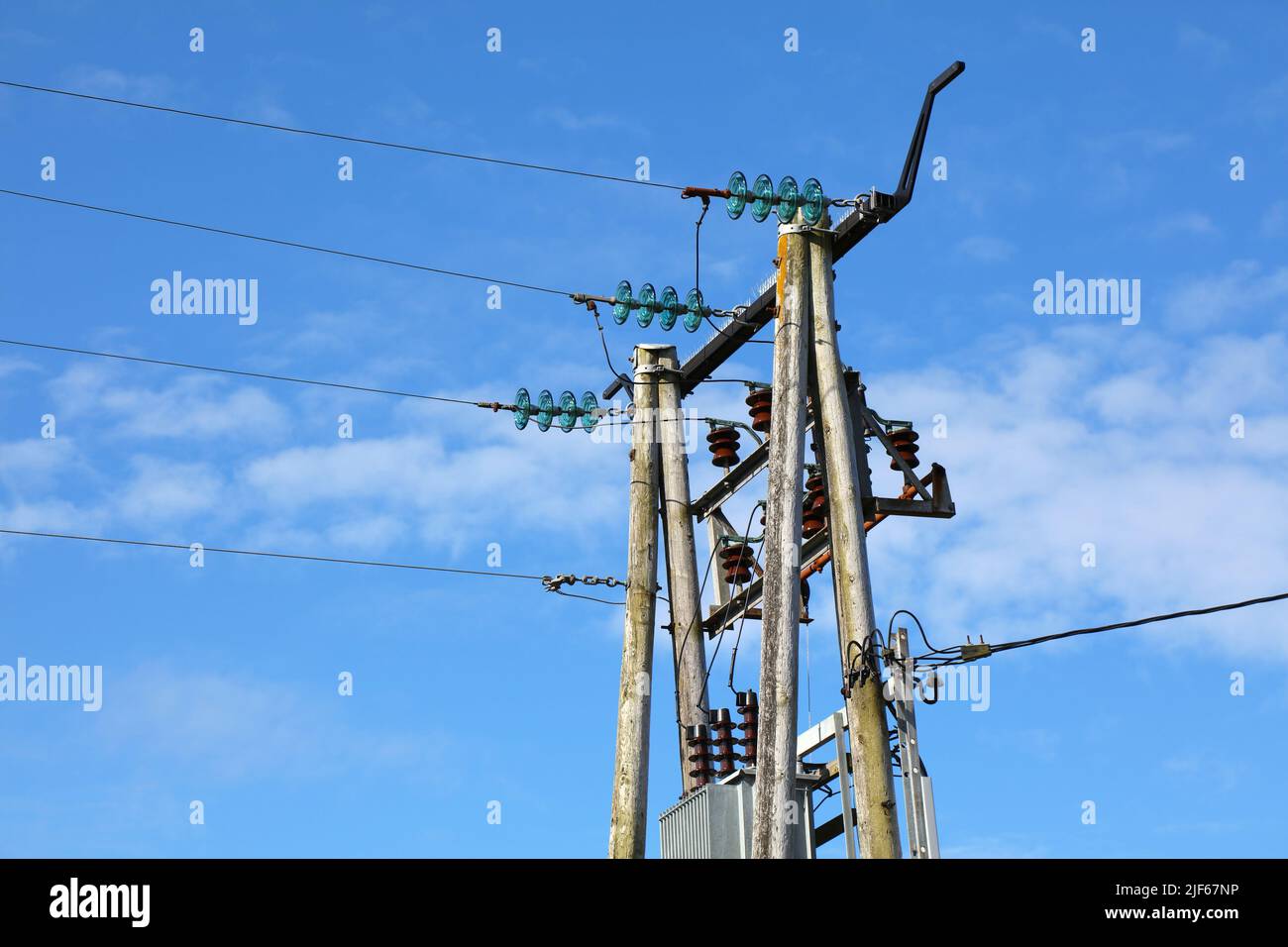 Electric grid in Norway. Wooden electric pole with glass insulators ...