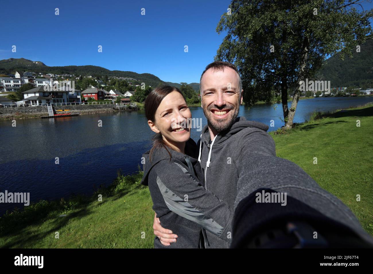Couple traveler selfie in Norway. Forde town in Sunnfjord commune ...