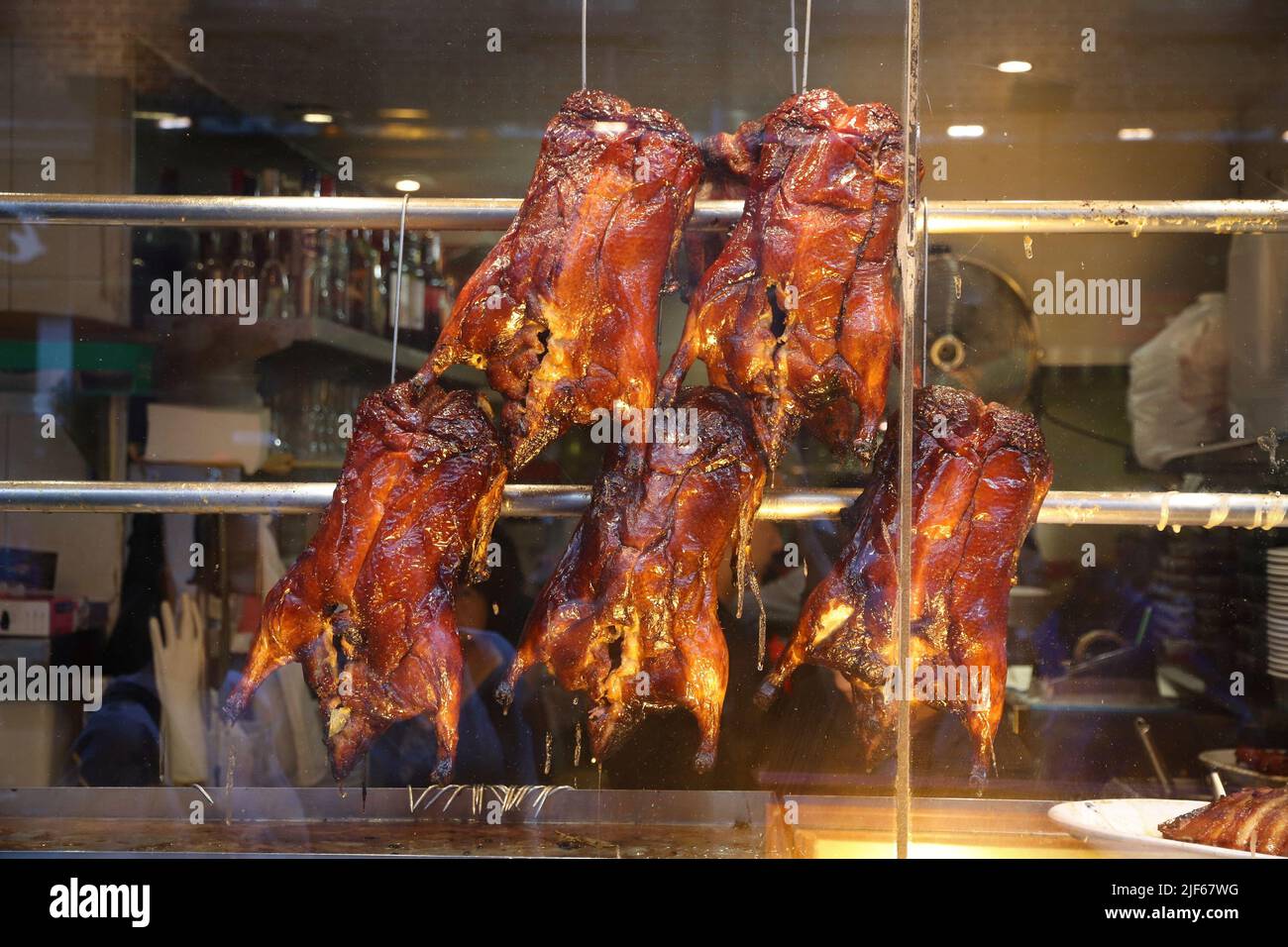 Peking roasted duck ready in a window of generic Chinatown restaurant ...