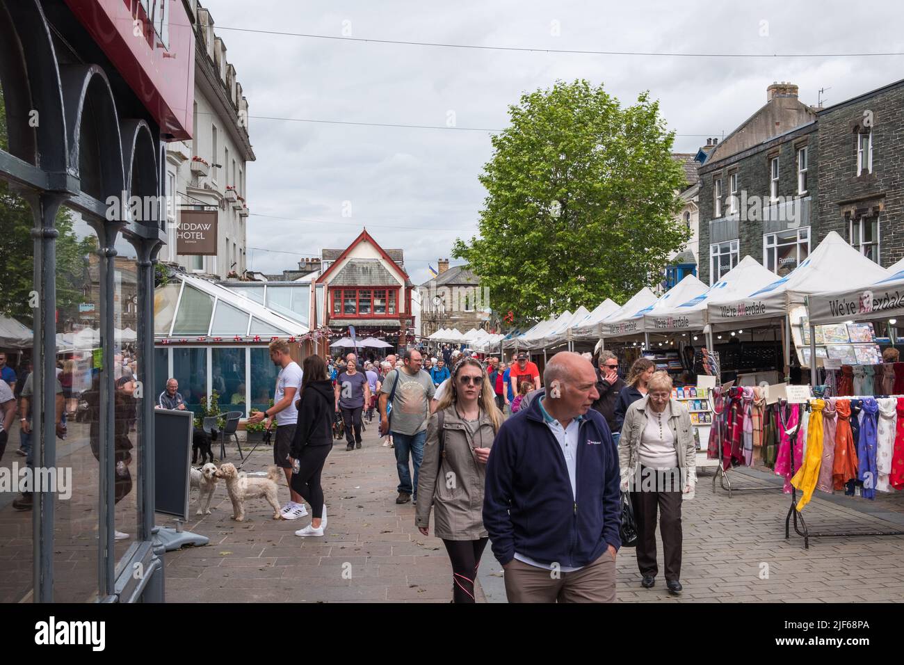 Visitors strolling through the shopping streets of the Lake District ...