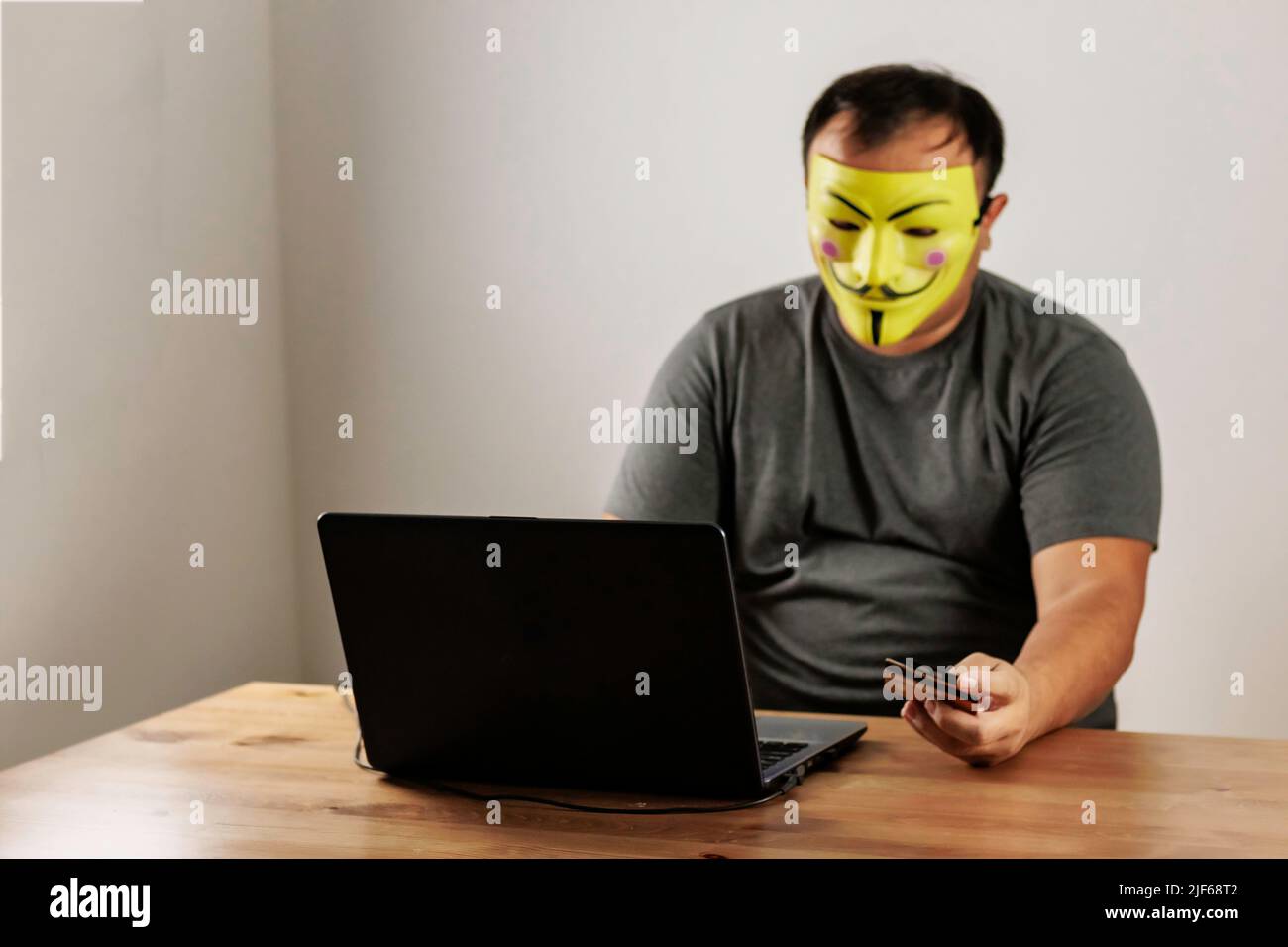 scammer calls the victim holding bank credit cards in his hand ...