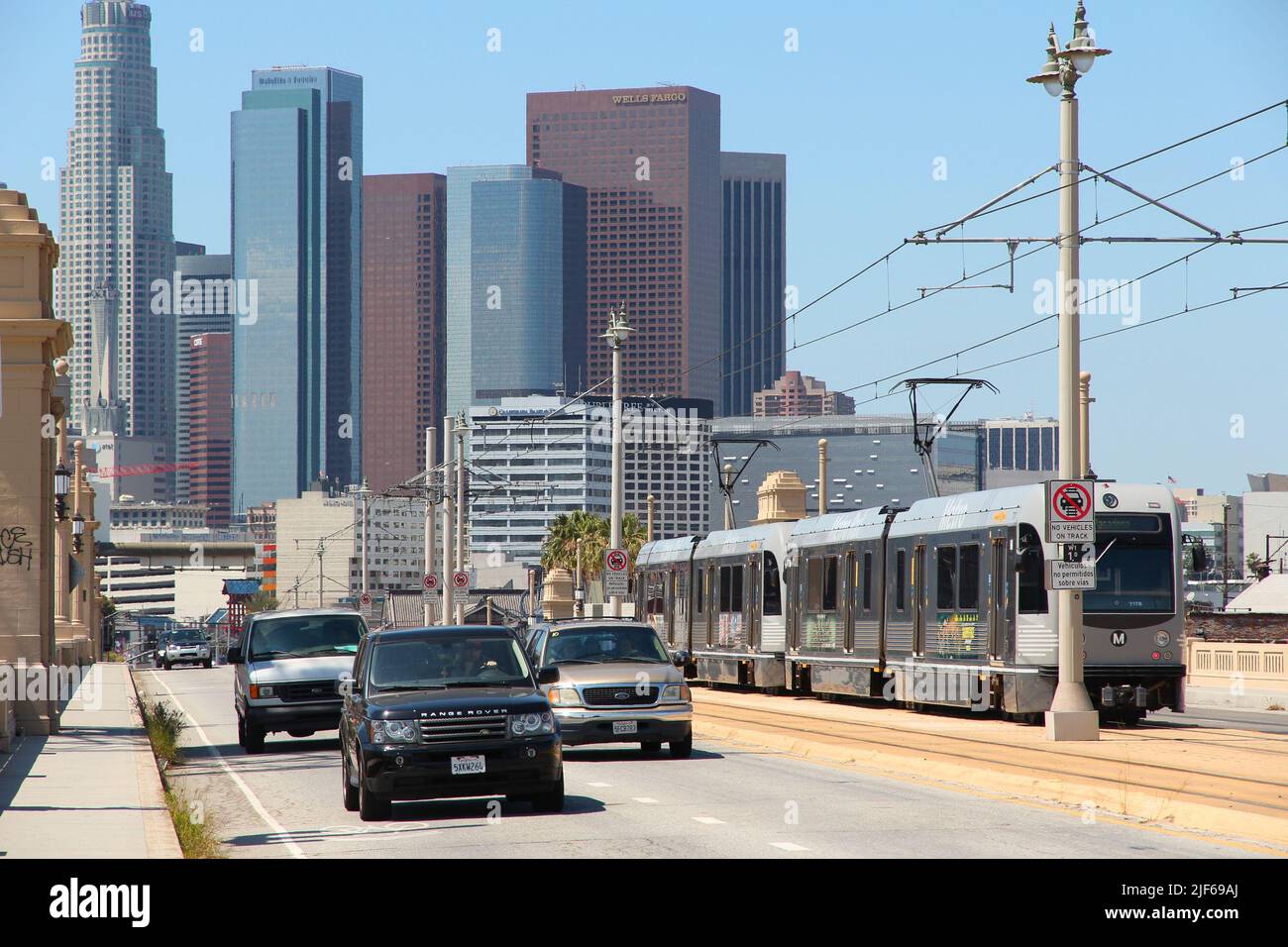 LOS ANGELES, USA - APRIL 5, 2014: Car traffic and Metro Rail tram in ...
