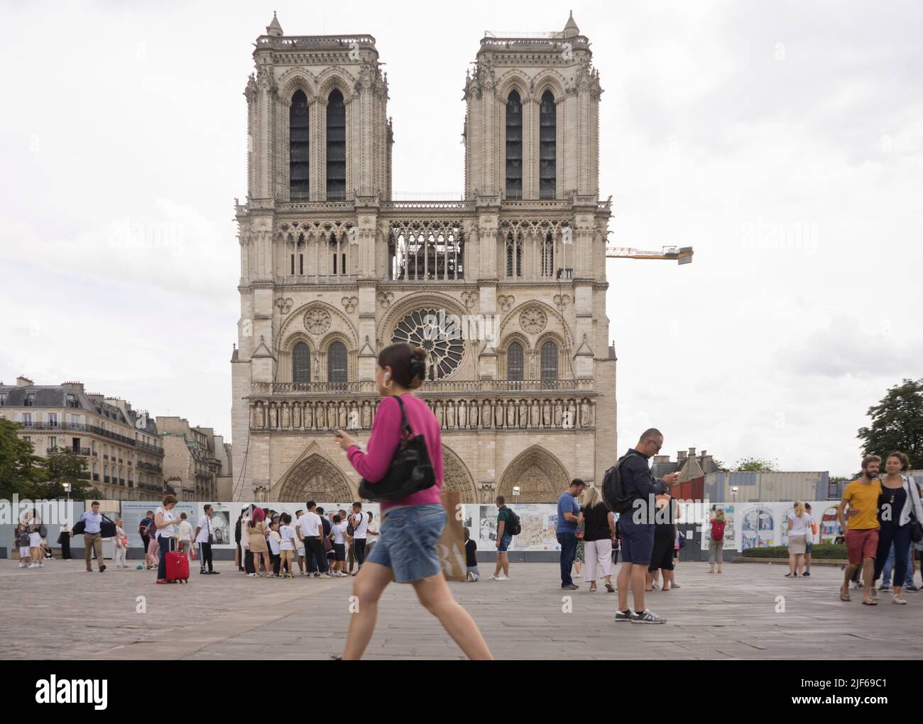 Visitors view the restoration of Notre Dame cathedral, partially ...