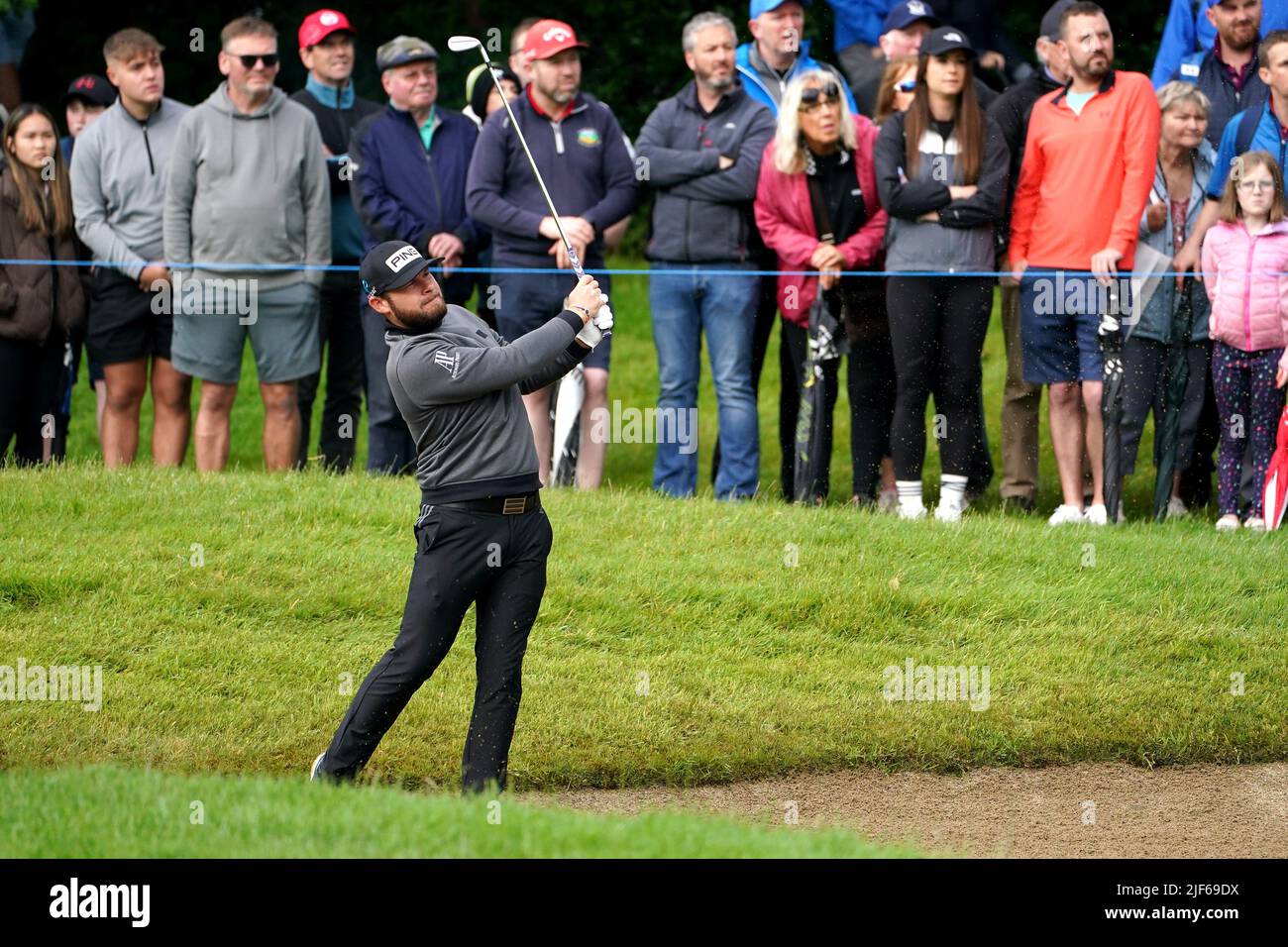 England's Tyrrell Hatton plays from the bunker on the 10th tee during ...