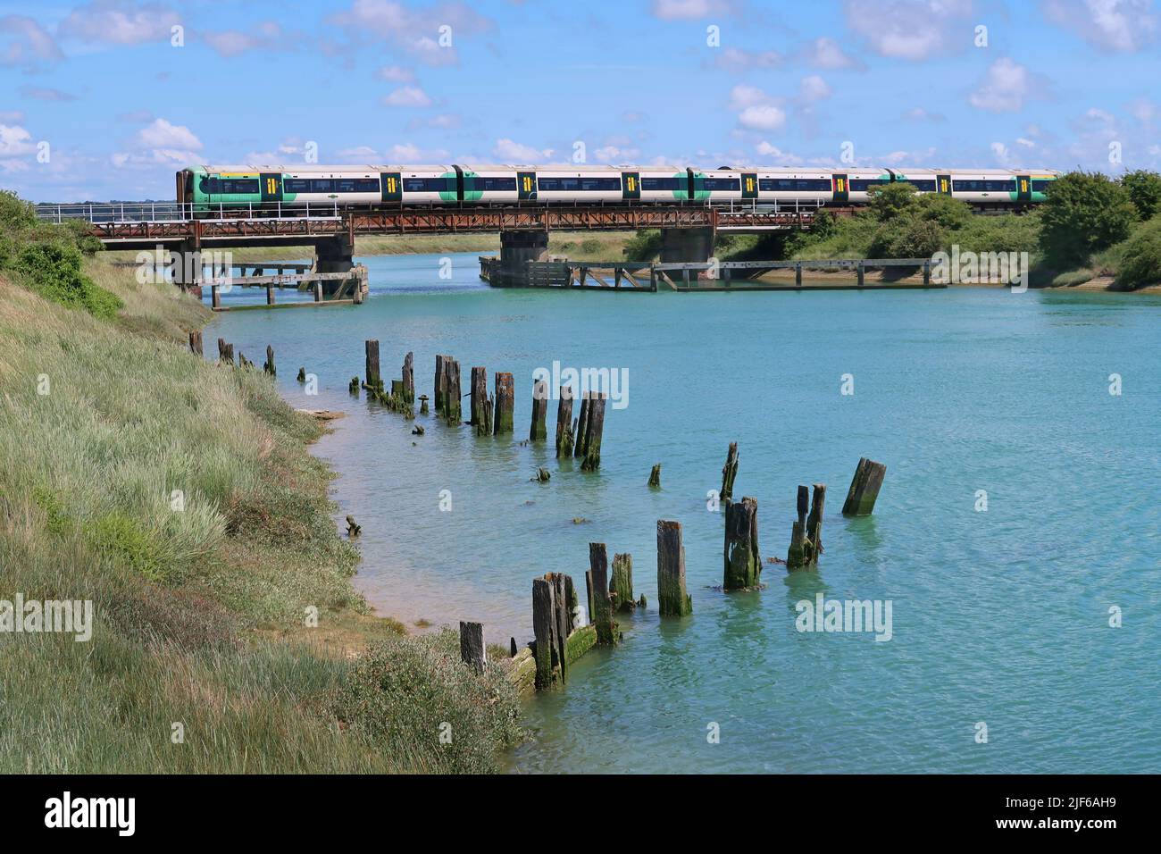 A Southern passenger train crosses the River Arun at Ford, near ...