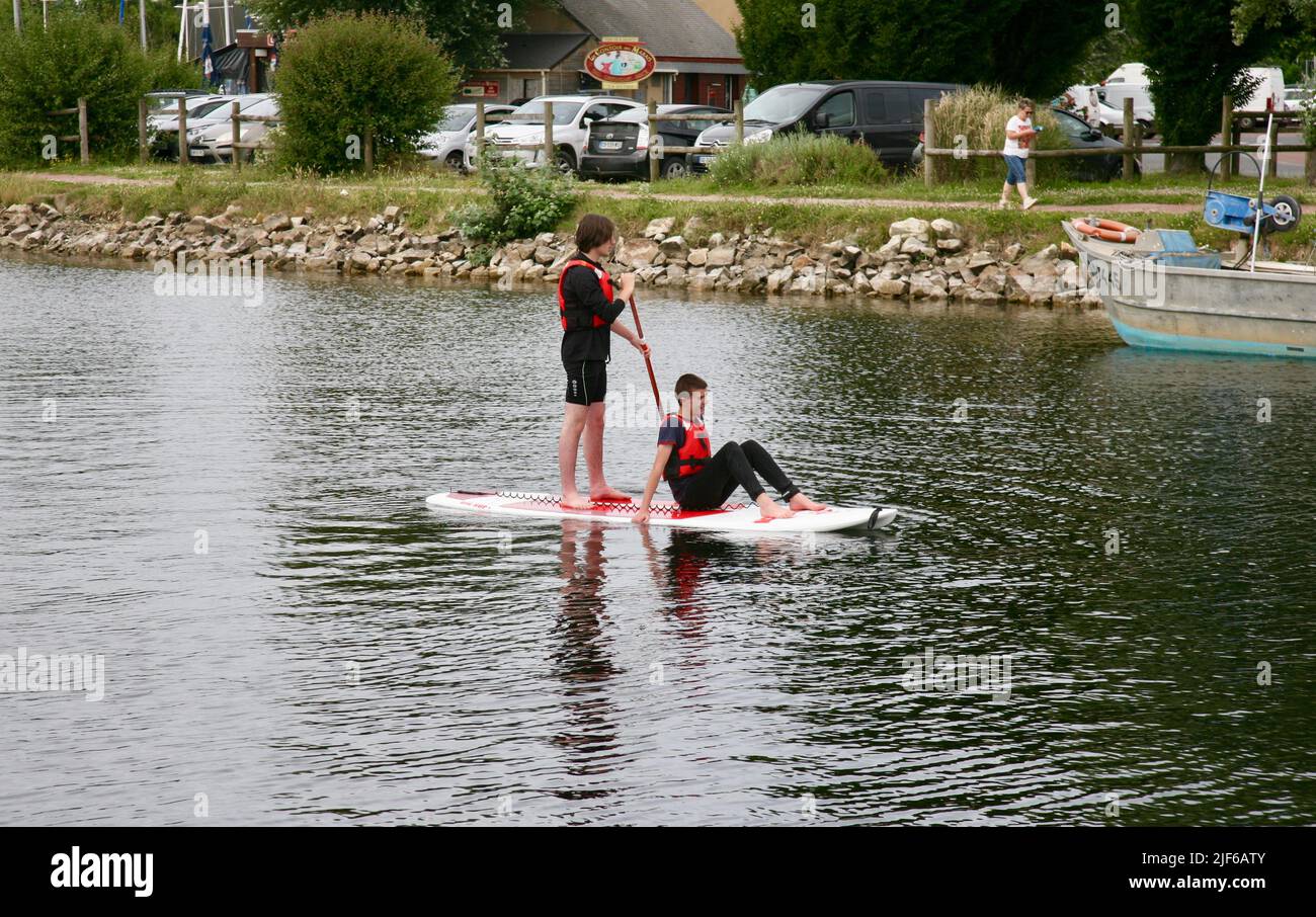 Having fun on the paddle board Stock Photo - Alamy