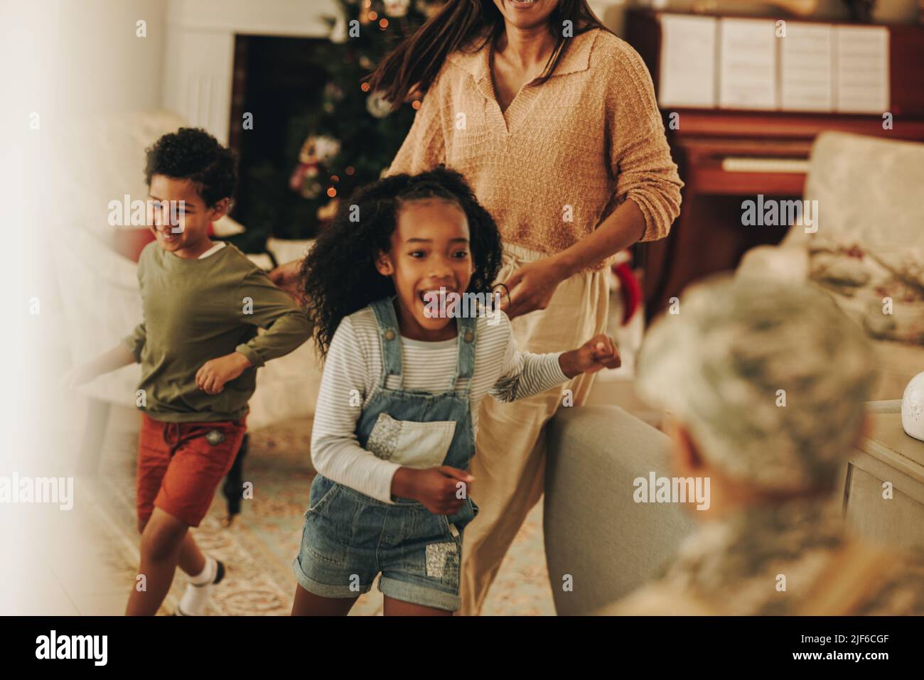 Ecstatic children running to welcome their father upon his return from ...