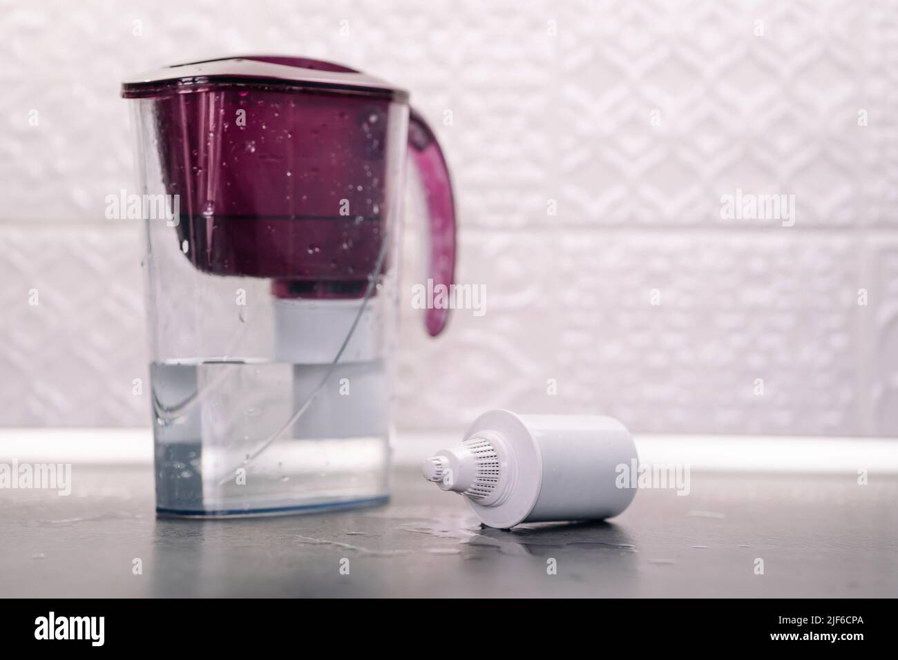 Absorbent substances in a plastic case. Water filter plastic jug with a ...