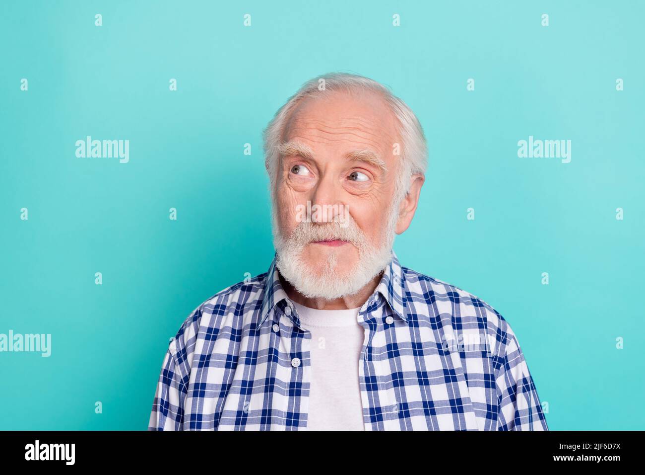 Portrait of interested unhappy old man brainstorming try to solve ...