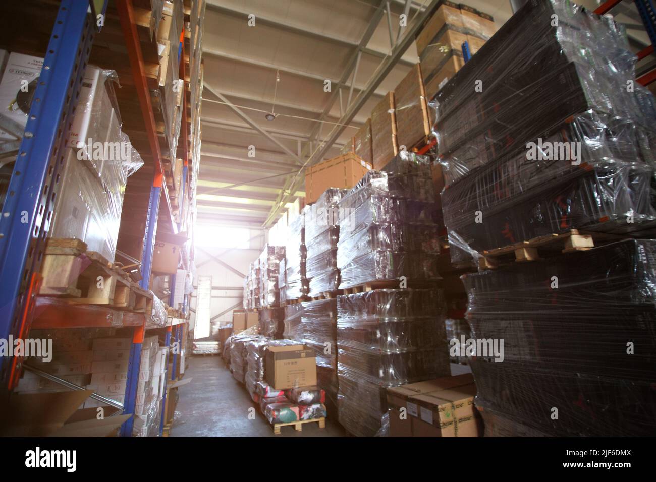 Goods and materials arranged on a rack in warehouse. Warehouse store ...