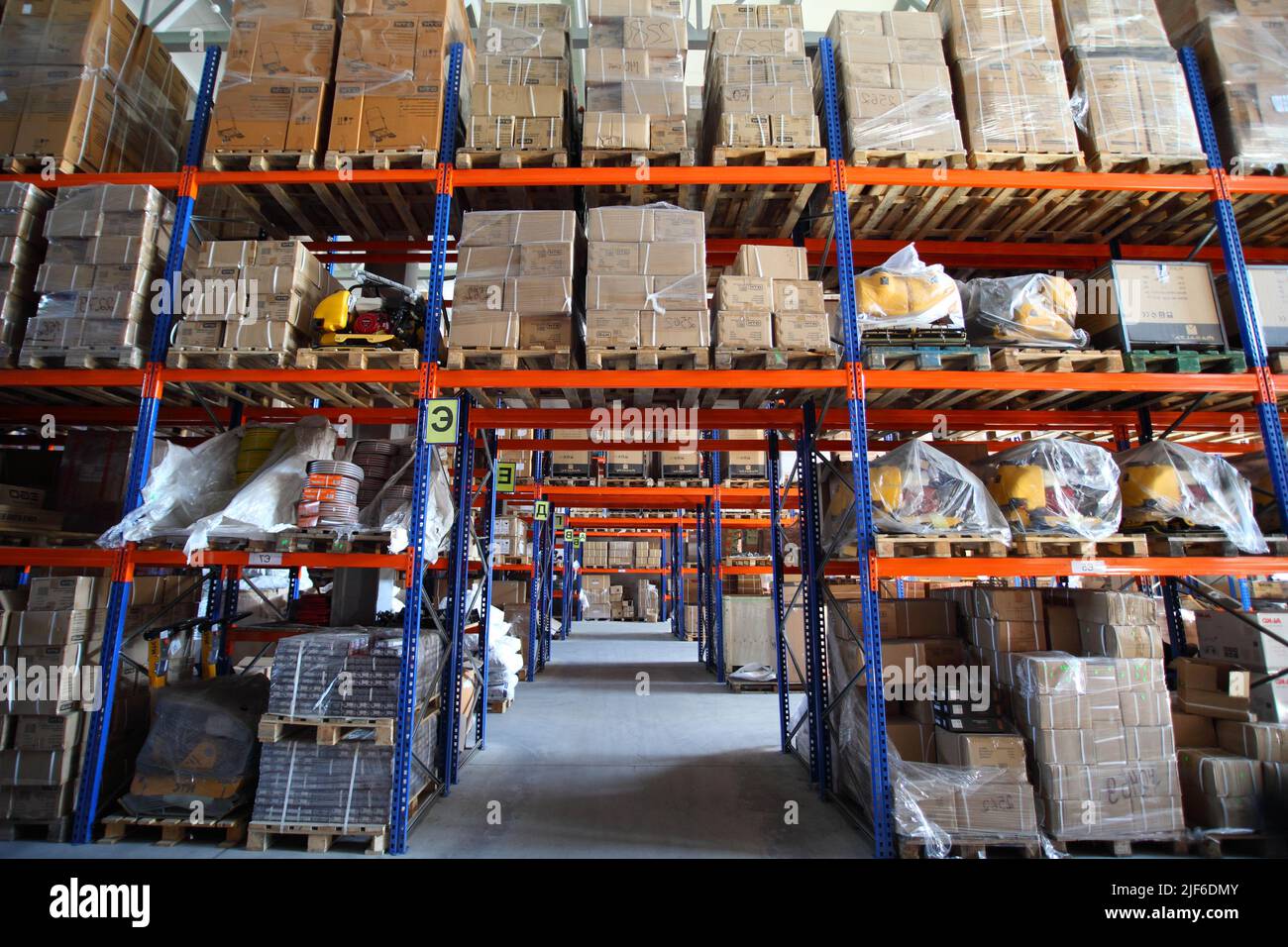 Goods and materials arranged on a rack in warehouse. Warehouse store ...