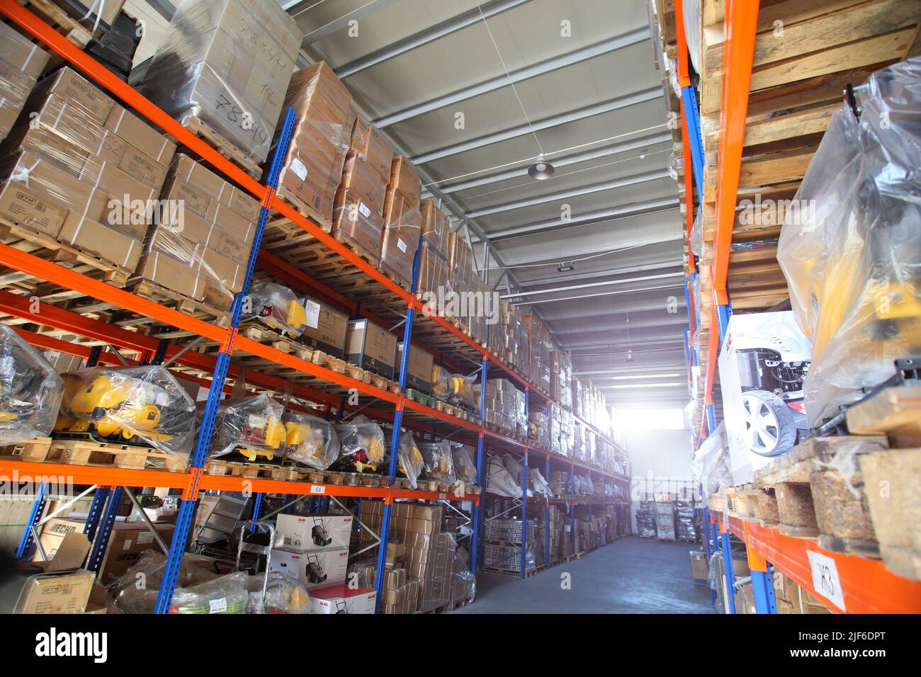 Goods and materials arranged on a rack in warehouse. Warehouse store ...
