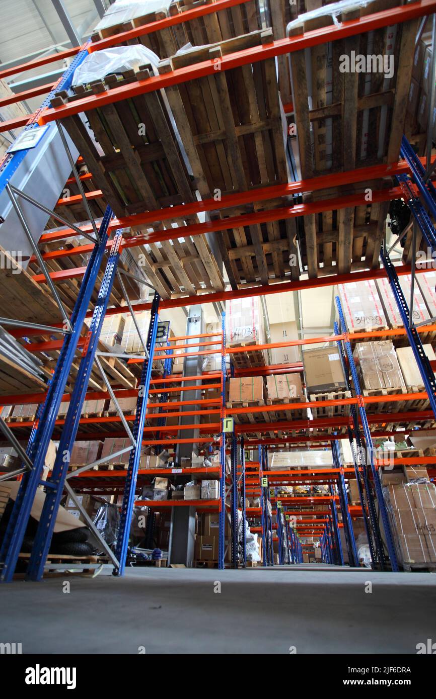Goods and materials arranged on a rack in warehouse. Warehouse store ...