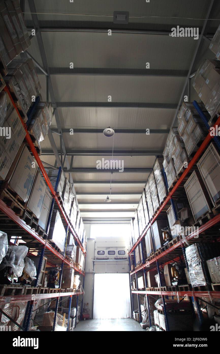 Goods and materials arranged on a rack in warehouse. Warehouse store ...