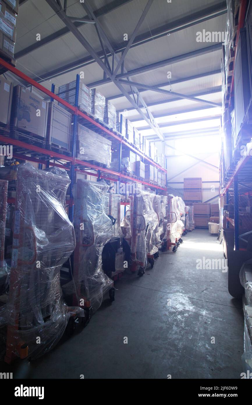 Goods and materials arranged on a rack in warehouse. Warehouse store ...