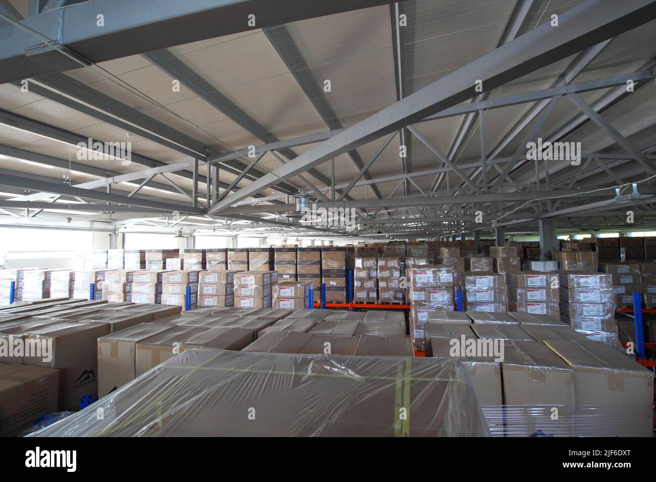 Goods and materials arranged on a rack in warehouse. Warehouse store ...