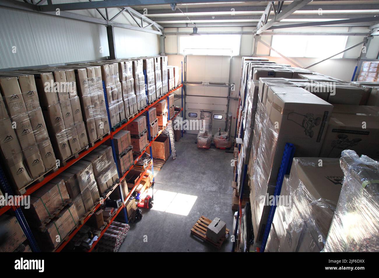 Goods and materials arranged on a rack in warehouse. Warehouse store ...