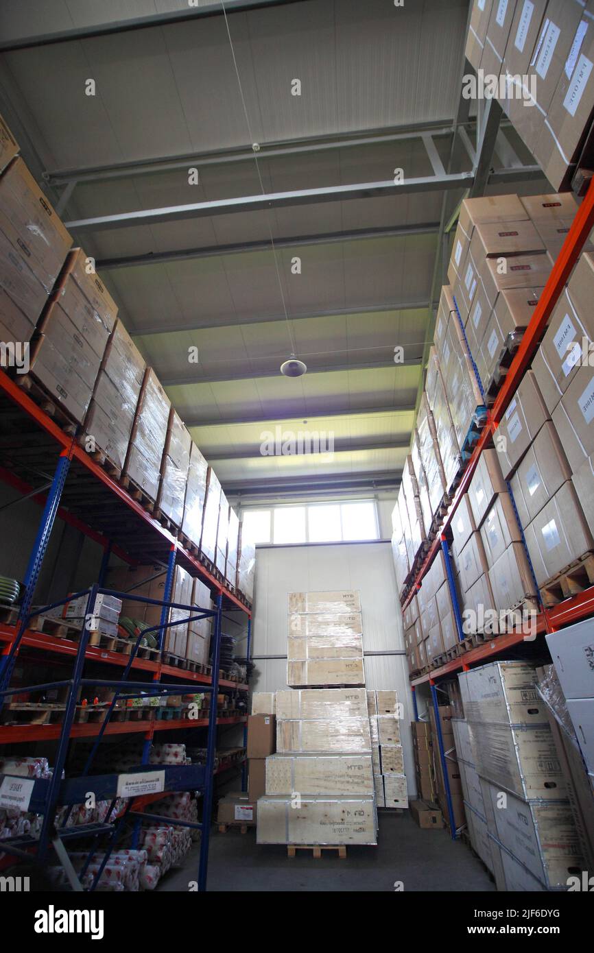 Goods and materials arranged on a rack in warehouse. Warehouse store ...