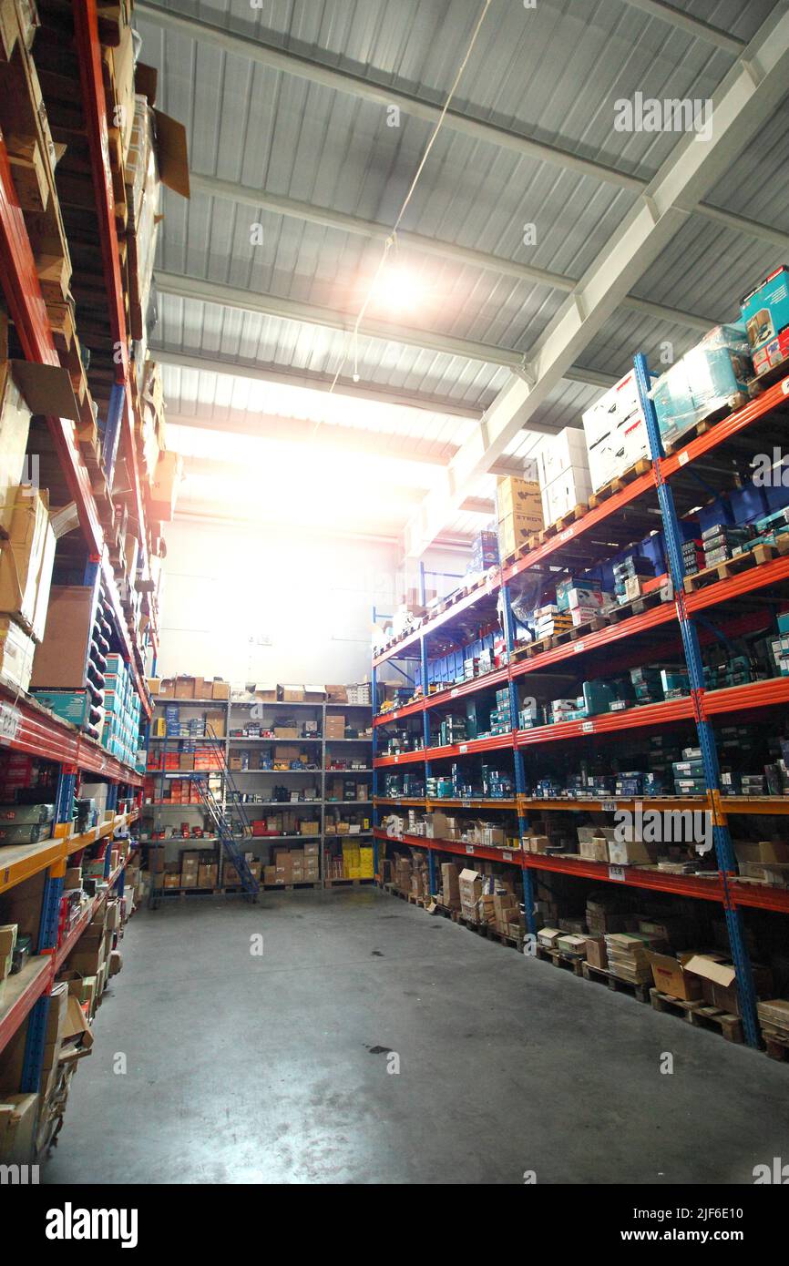 Goods and materials arranged on a rack in warehouse. Warehouse store ...