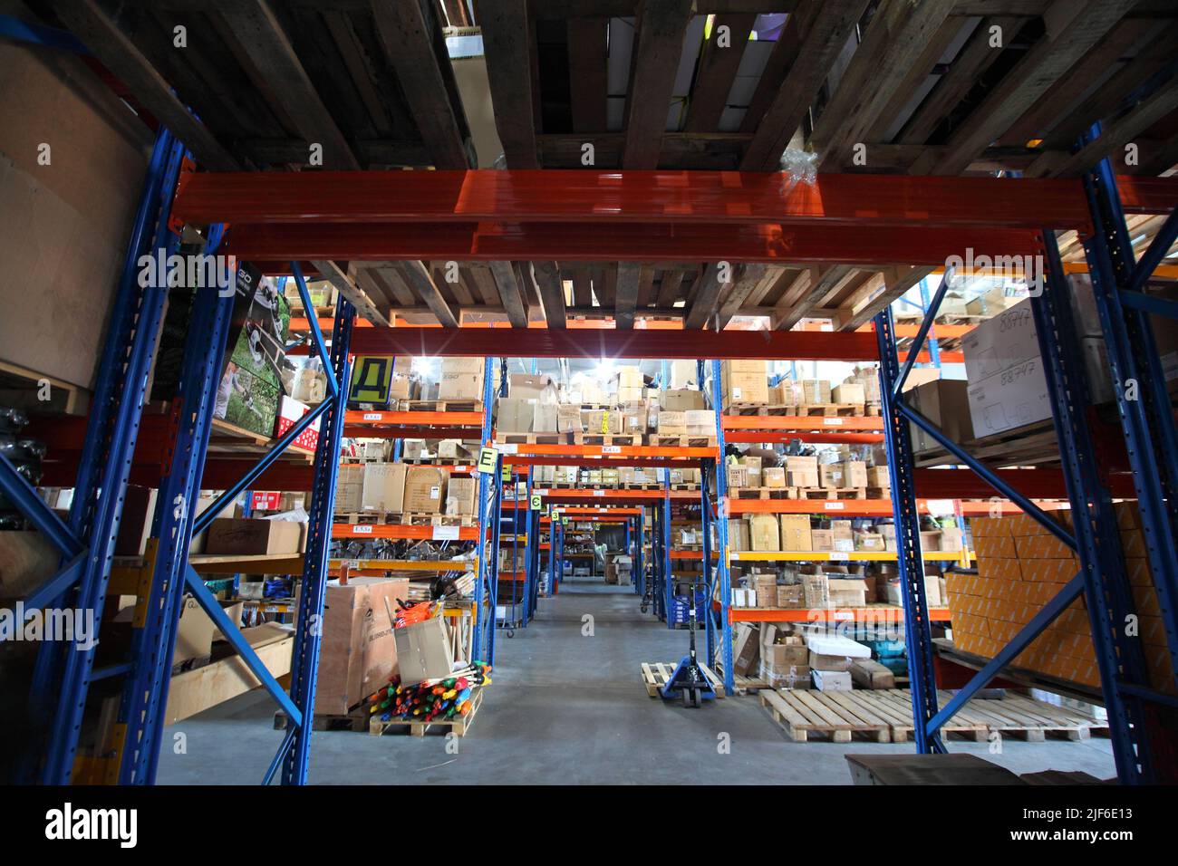 Goods and materials arranged on a rack in warehouse. Warehouse store ...
