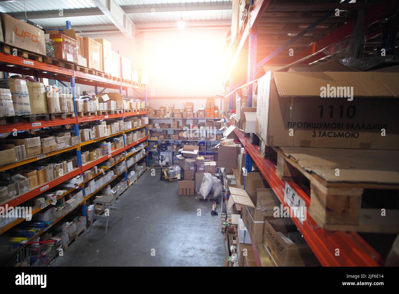 Goods and materials arranged on a rack in warehouse. Warehouse store ...