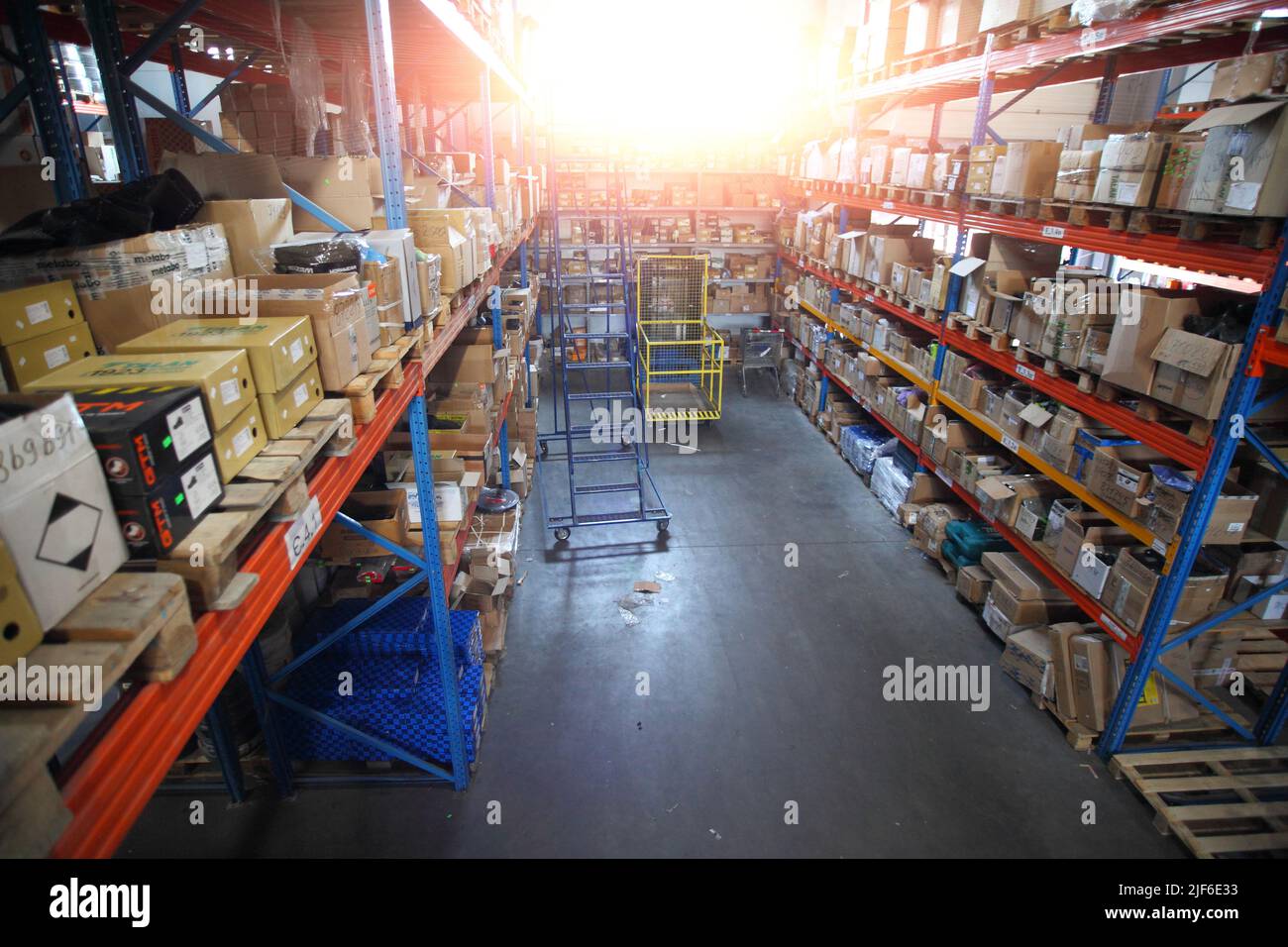 Goods and materials arranged on a rack in warehouse. Warehouse store ...