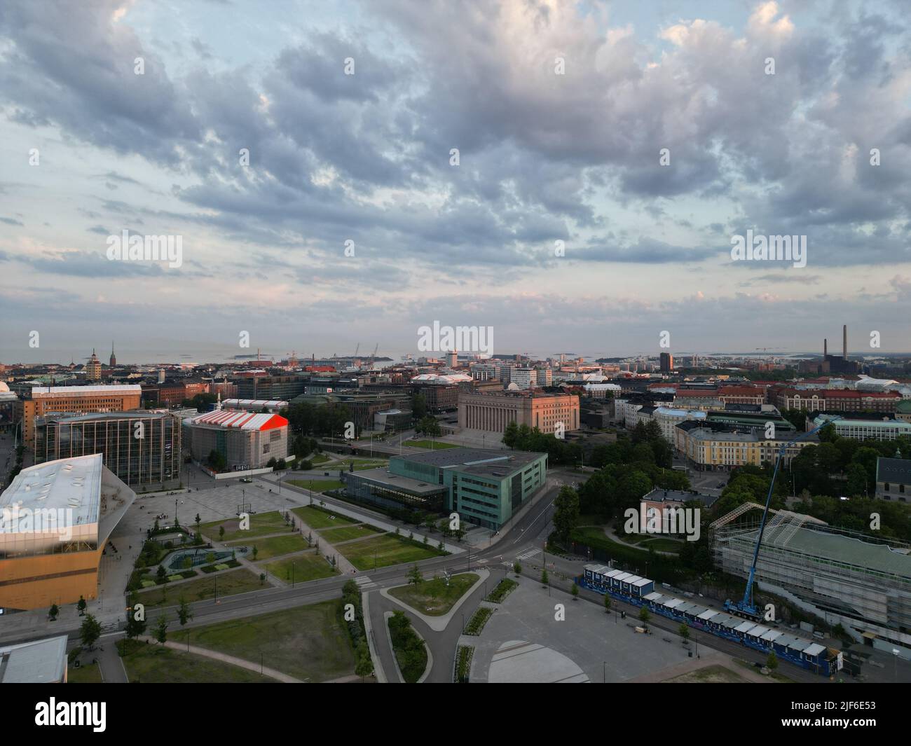 A bird's eye view of the cityscape of Helsinki under a cloudy sky in ...