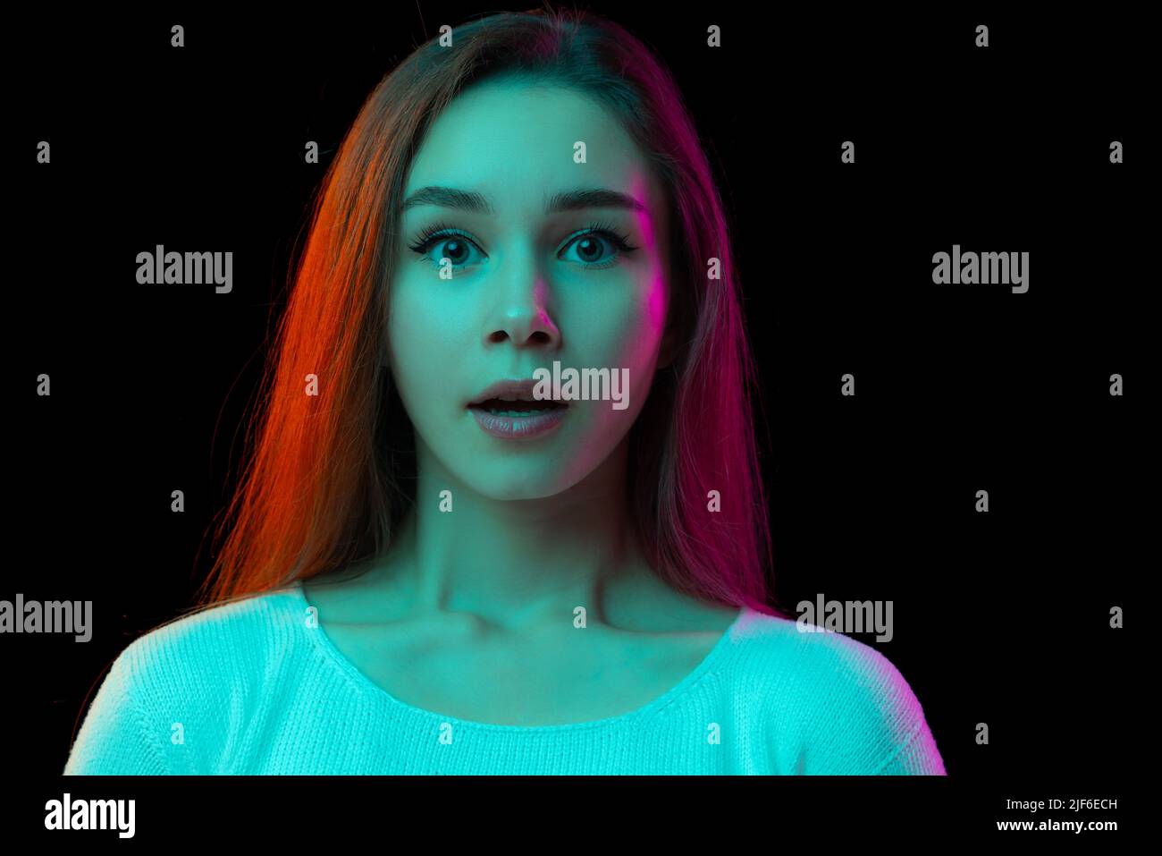 Portrait of young emotive girl posing, showing shocked expression ...